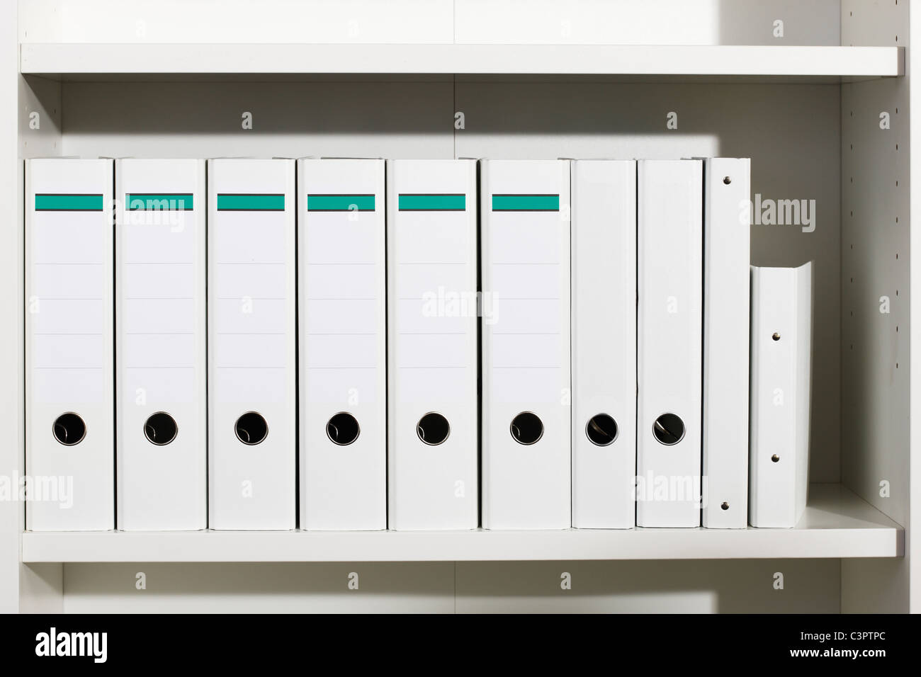 Folders in shelf, close up Stock Photo - Alamy