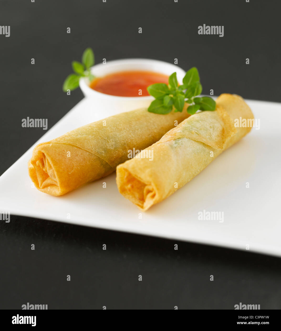 Spring rolls with chili sauce Stock Photo - Alamy