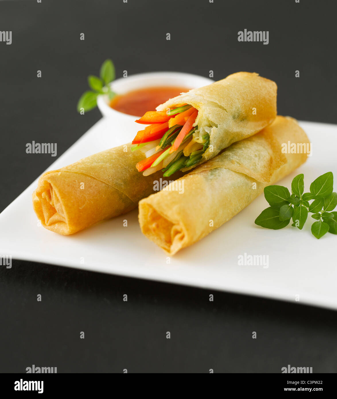 Spring rolls with chili sauce Stock Photo - Alamy