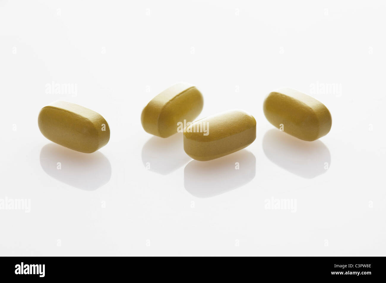 Tablets on white background Stock Photo - Alamy