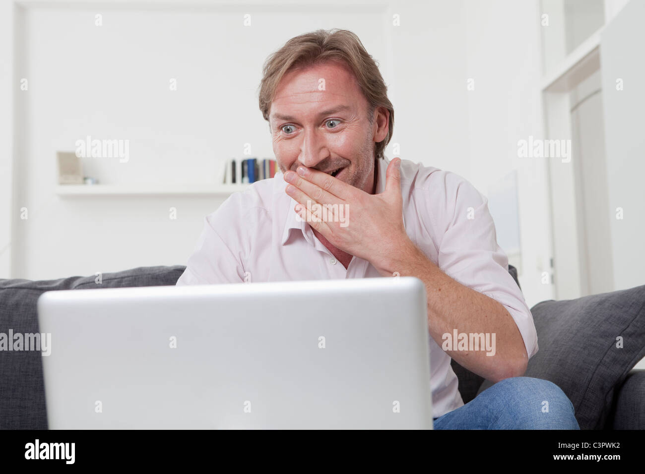 Man using laptop Stock Photo - Alamy
