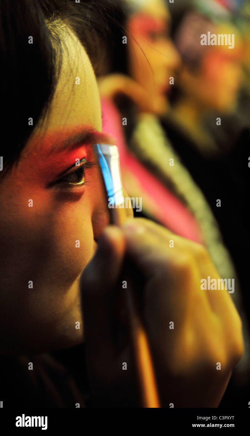 Chinese opera performers putting up makeup in the dressing room Stock ...