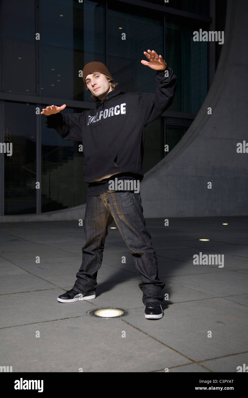 Man standing gesturing, portrait Stock Photo - Alamy