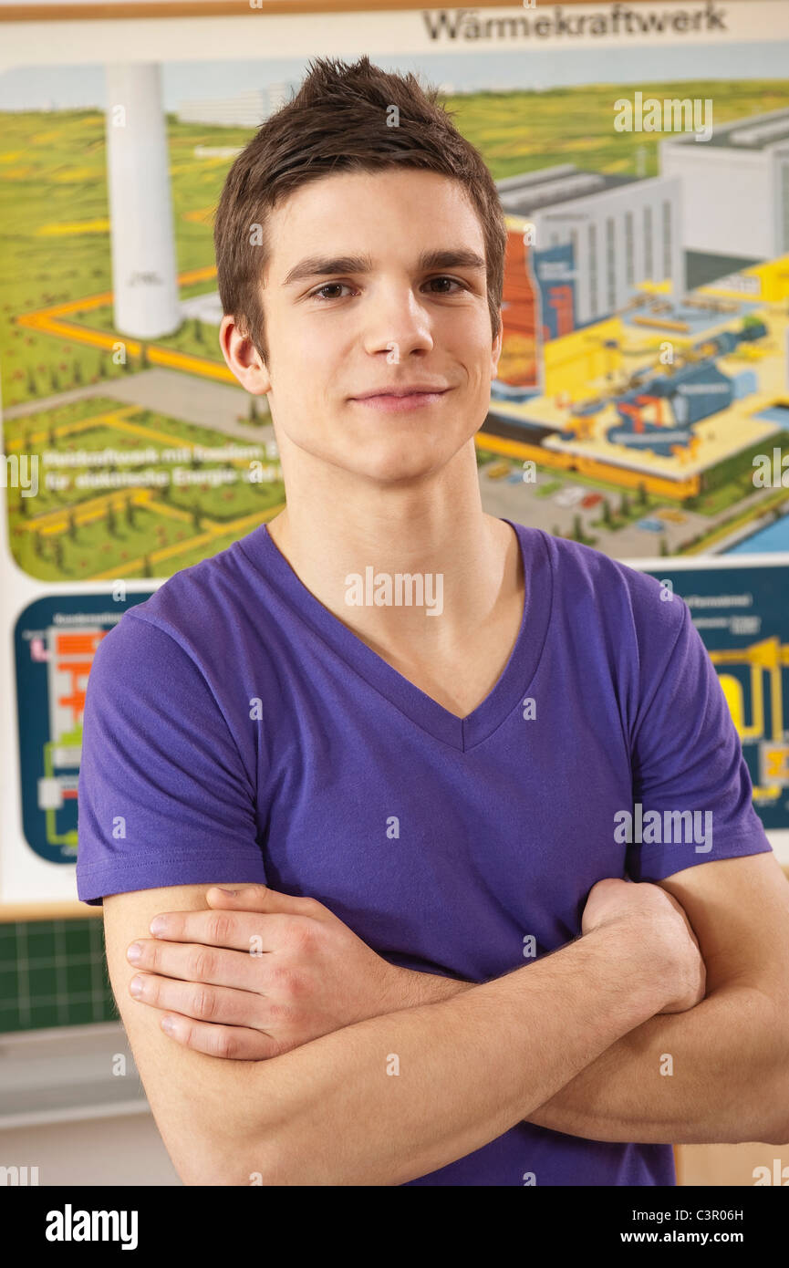 Germany, Emmering, Teenage boy arms crossed, smiling, portrait Stock ...
