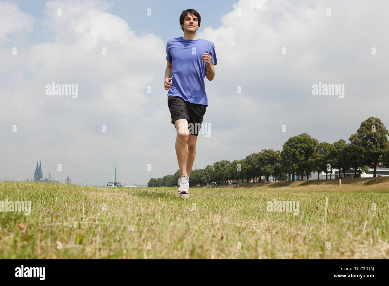Germany, Cologne, Young man jogging Stock Photo - Alamy