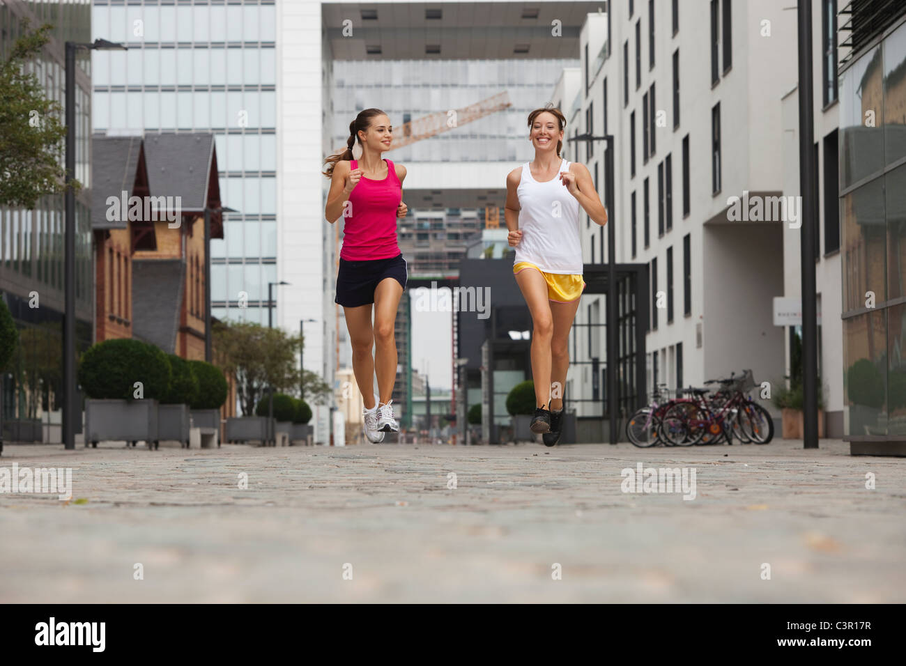 Germany, Cologne, Young women jogging Stock Photo - Alamy