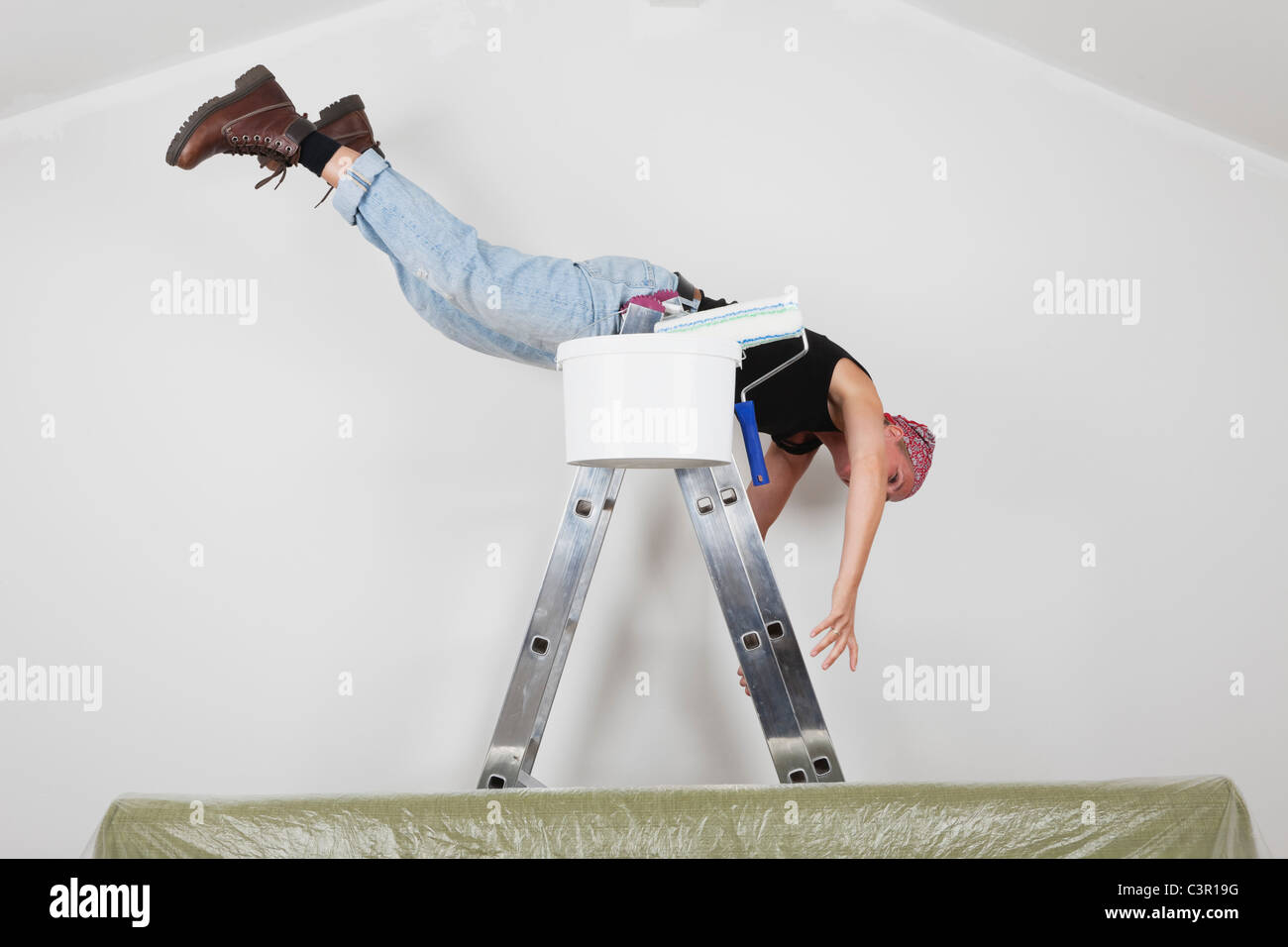 Woman falling ladder hi-res stock photography and images - Alamy