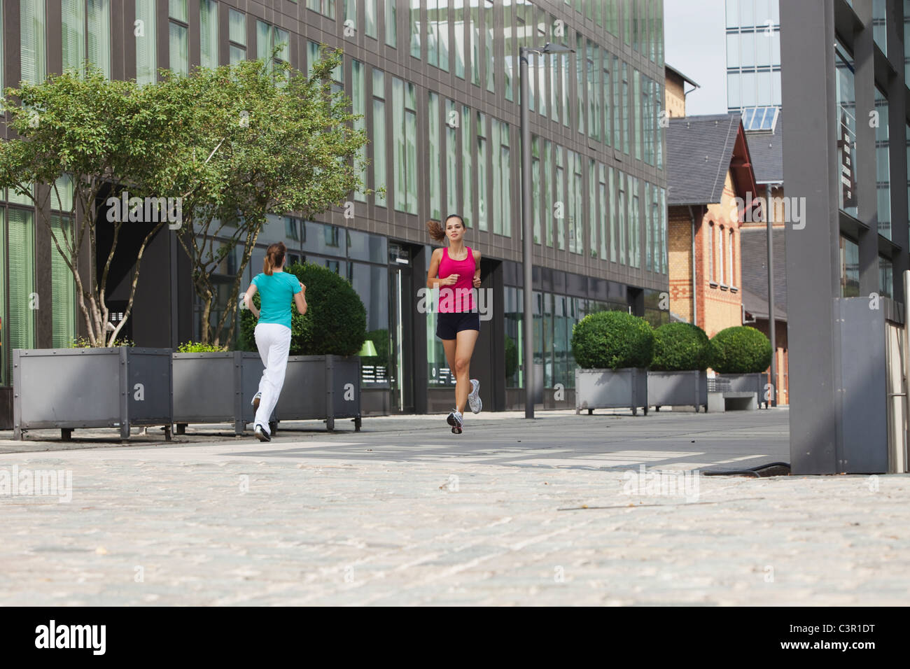 Germany, Cologne, Young women jogging Stock Photo - Alamy