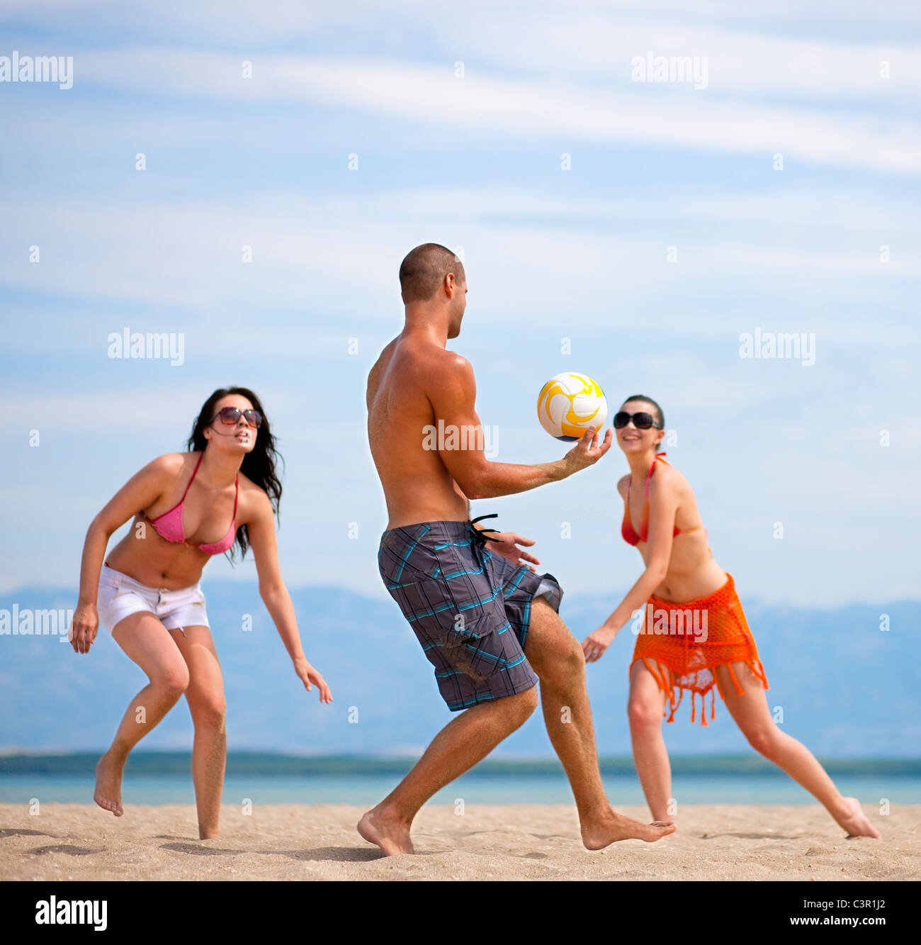 Croatia, Zadar, Friends playing volley ball at beach Stock Photo - Alamy