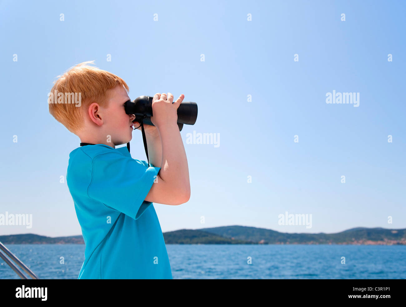 Croatia, Zadar, Boy looking through an binocular Stock Photo - Alamy