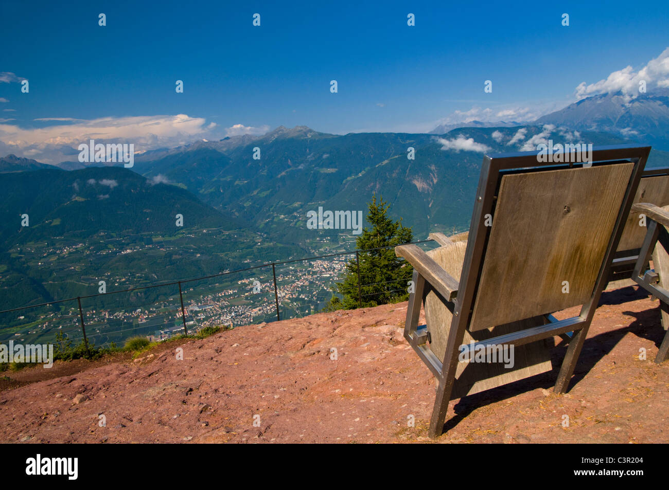 Italy, South Tyrol, Meran, View of village with mountain from platform ...