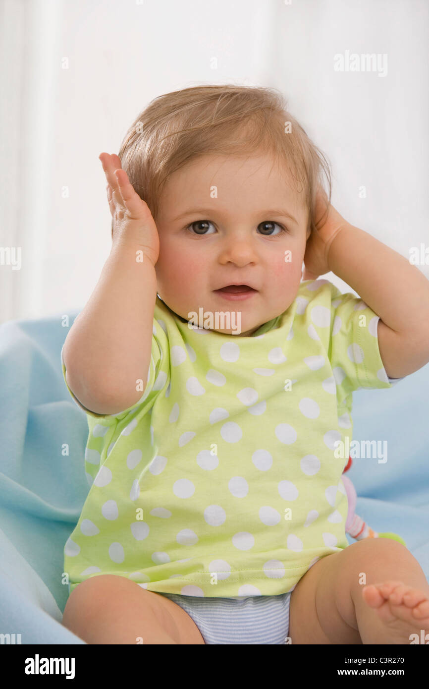 Child with hands over ears hi-res stock photography and images - Alamy