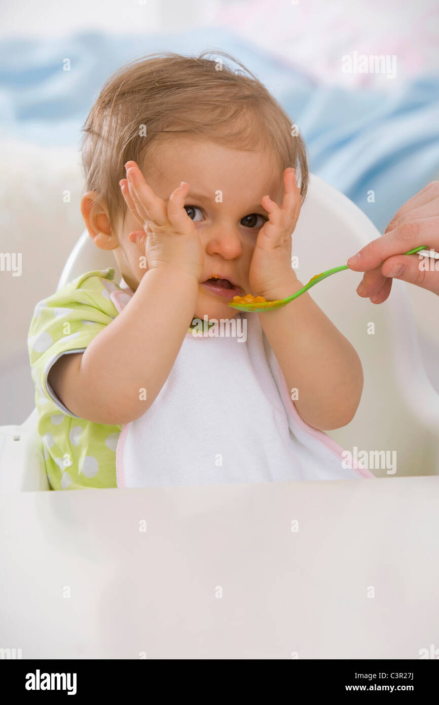 Human hand feeding baby girl (6-11 months Stock Photo - Alamy