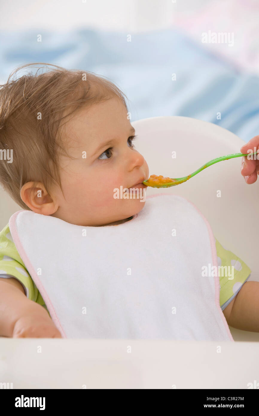 Human hand feeding baby girl (6-11 months Stock Photo - Alamy