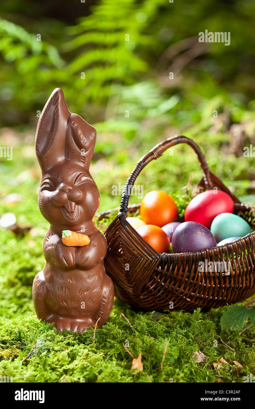 Germany, Lower Bavaria, Variety of easter eggs in basket on moss in the ...