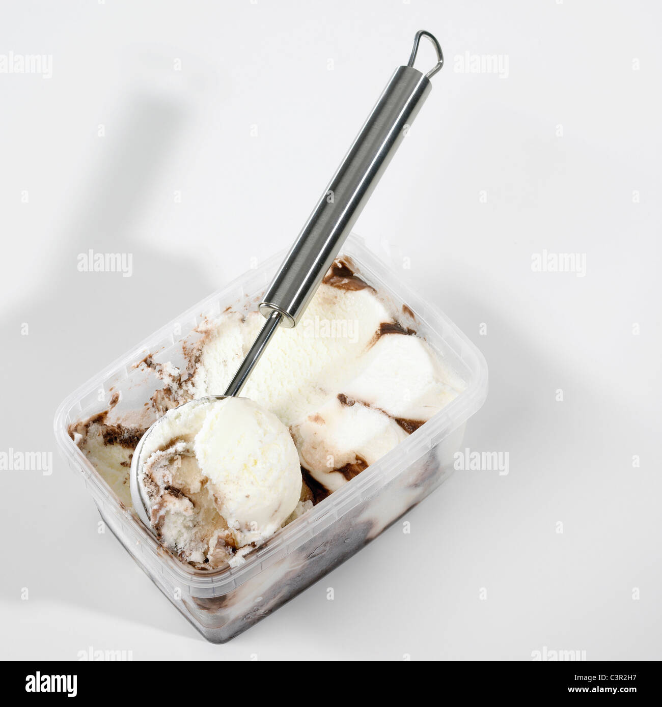 Ice cream with scooper in container, close-up Stock Photo - Alamy