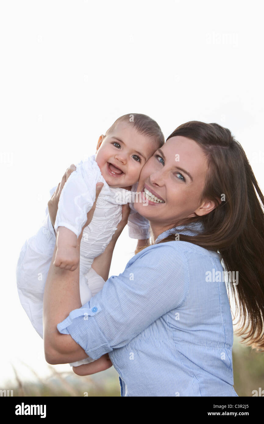 Germany, Bavaria, Mother with (2-5 months) baby girl, smiling Stock ...