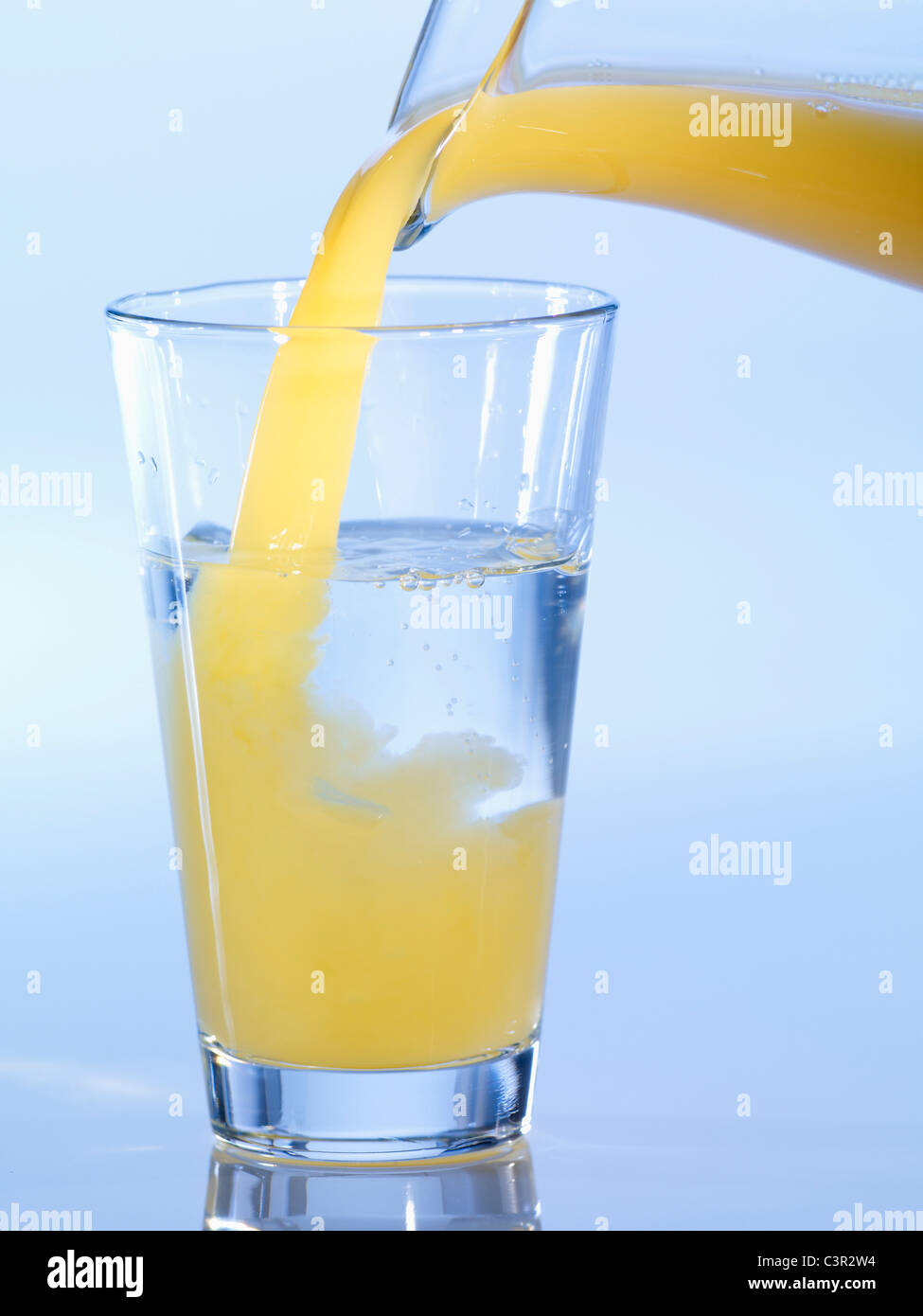 Pouring orange juice in glass, close-up Stock Photo - Alamy