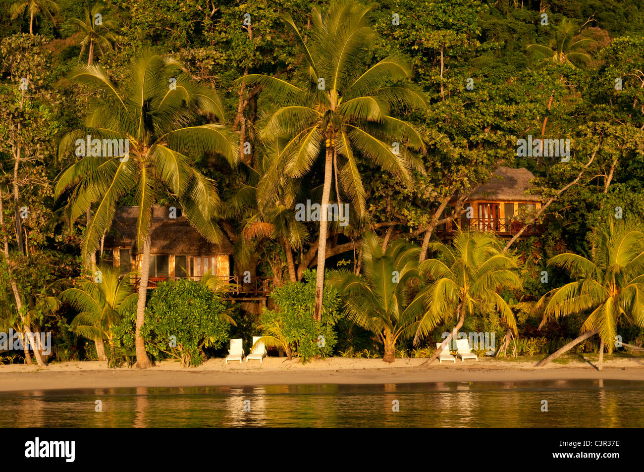 Beach and guest lodging at Matangi Private Island Resort, Fiji Stock ...