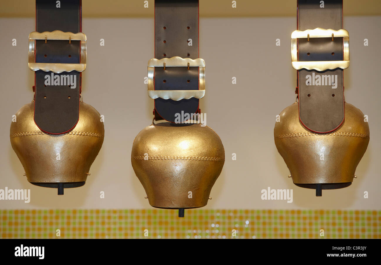 Row of hanging cow bell, close up Stock Photo - Alamy