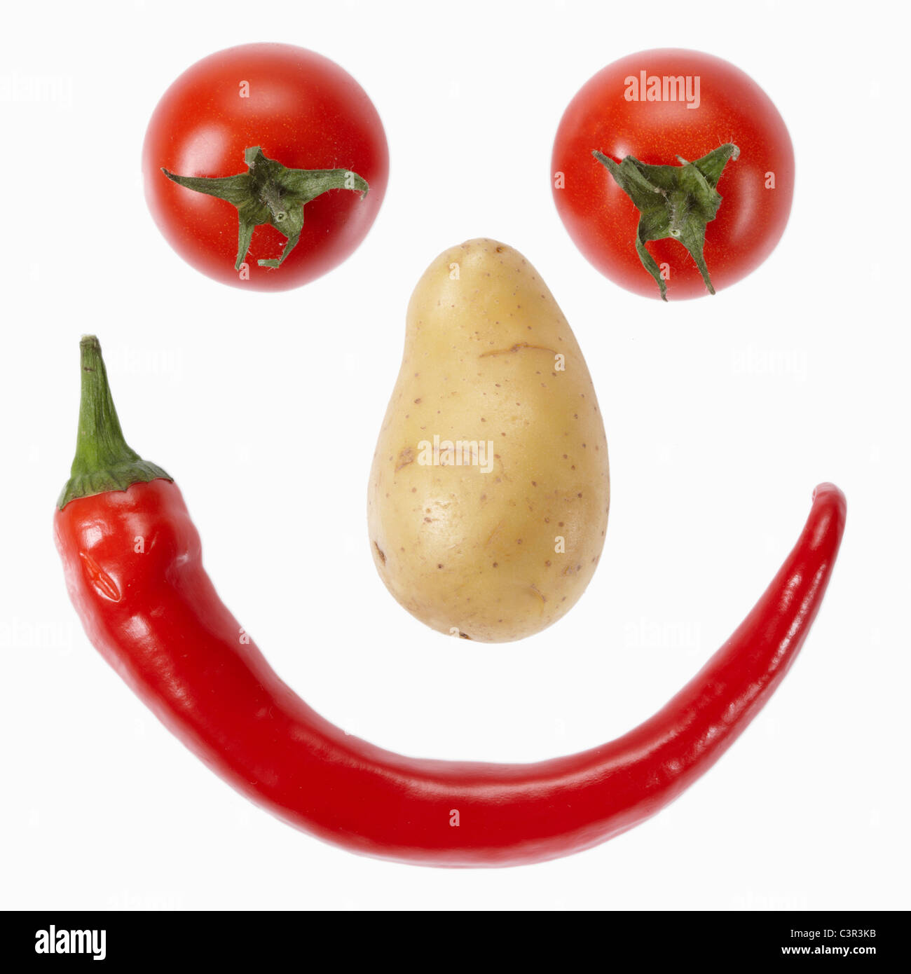 Vegetable simley face against white background Stock Photo - Alamy