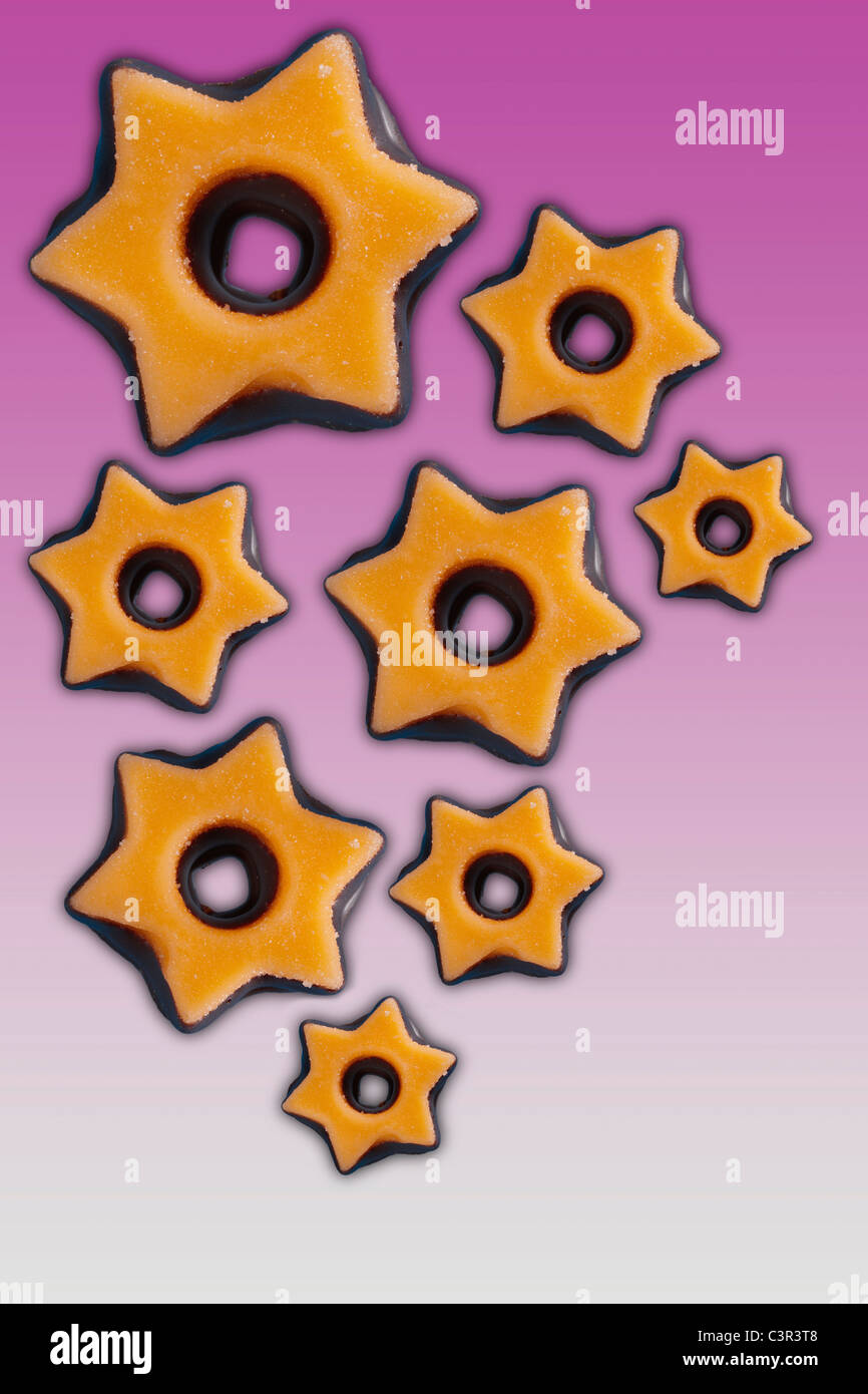 Star shape christmas biscuits against pink background Stock Photo - Alamy