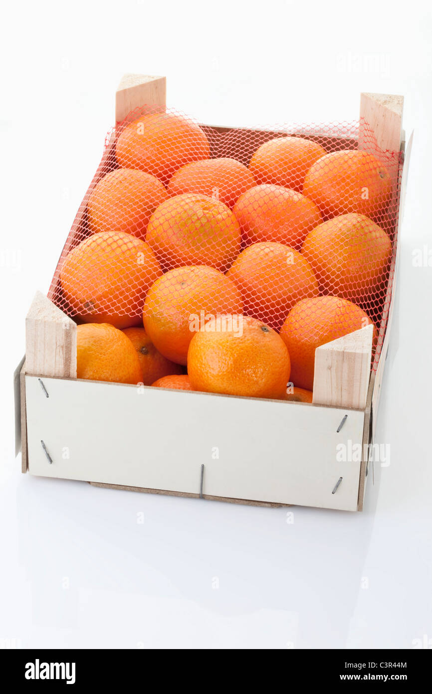 Tangerines in box on white background Stock Photo - Alamy