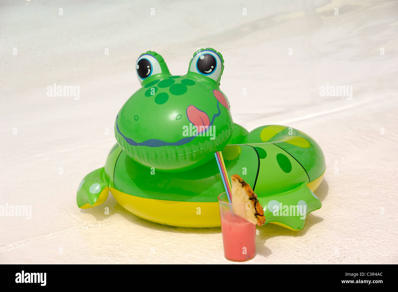 Happy frog is enjoying a cold drink by the pool Stock Photo - Alamy