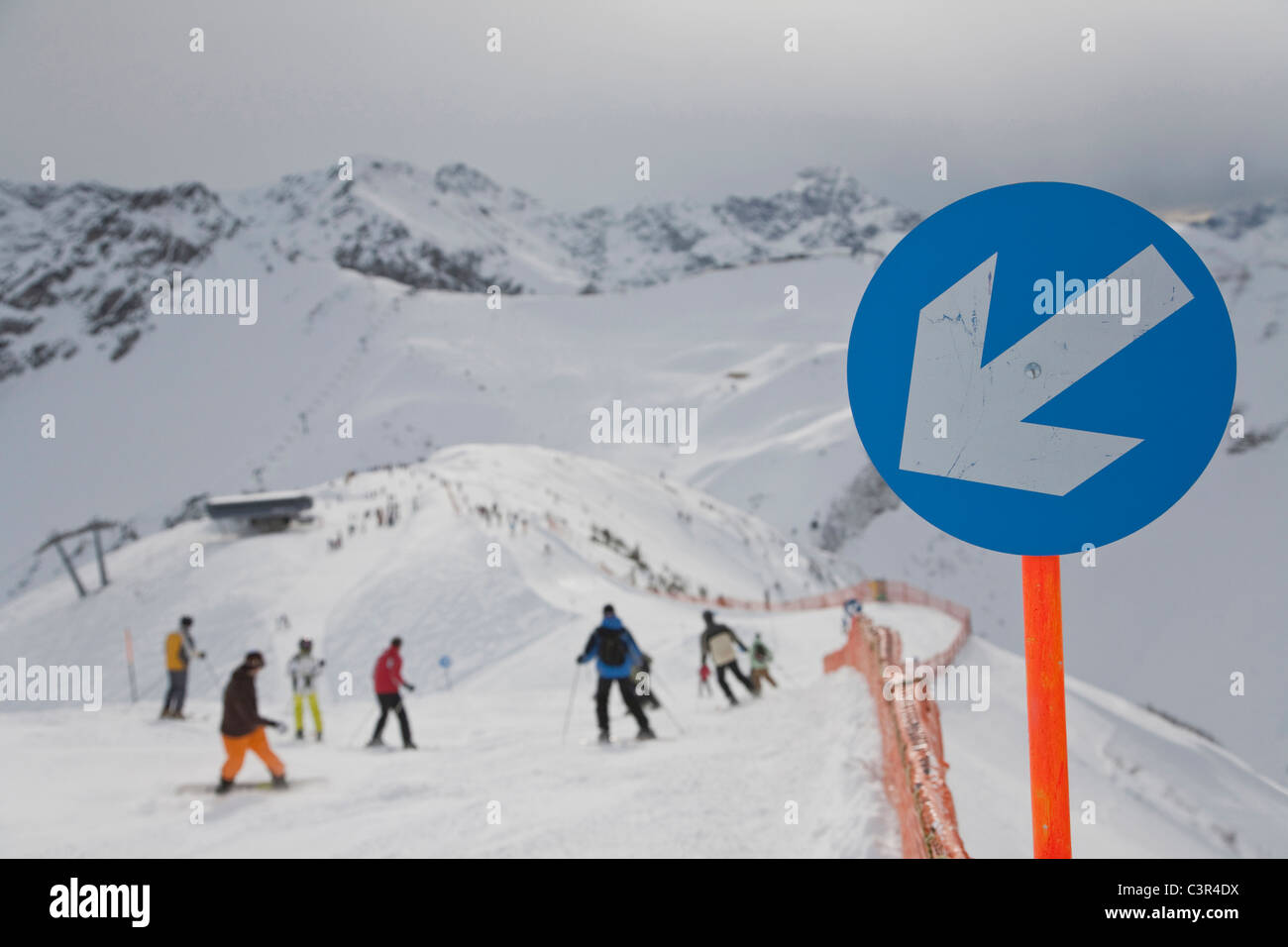 Germany, Oberstdorf, slope sign, Slope sign with skier skiing in ...