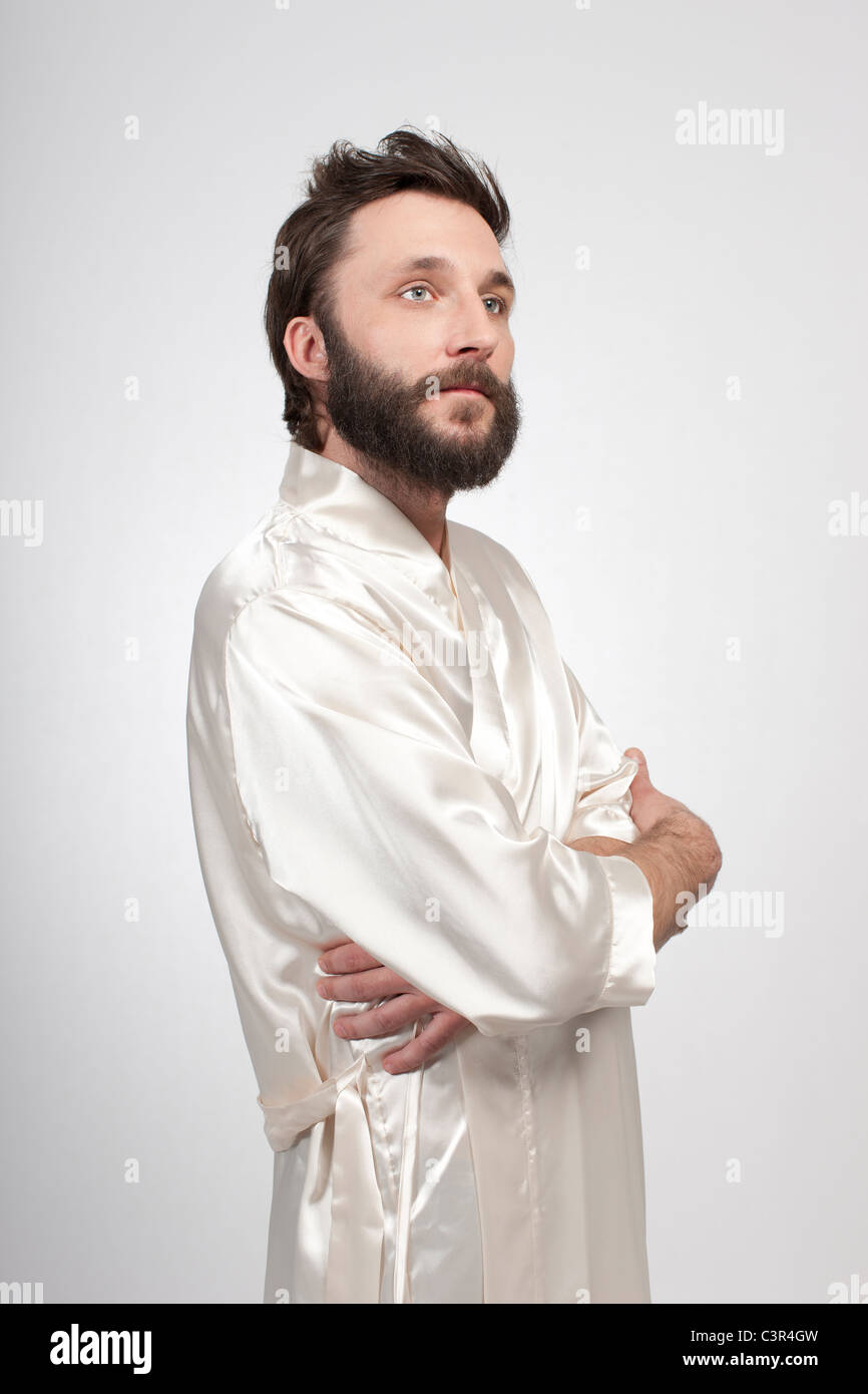 Man in silk robe looking away Stock Photo - Alamy