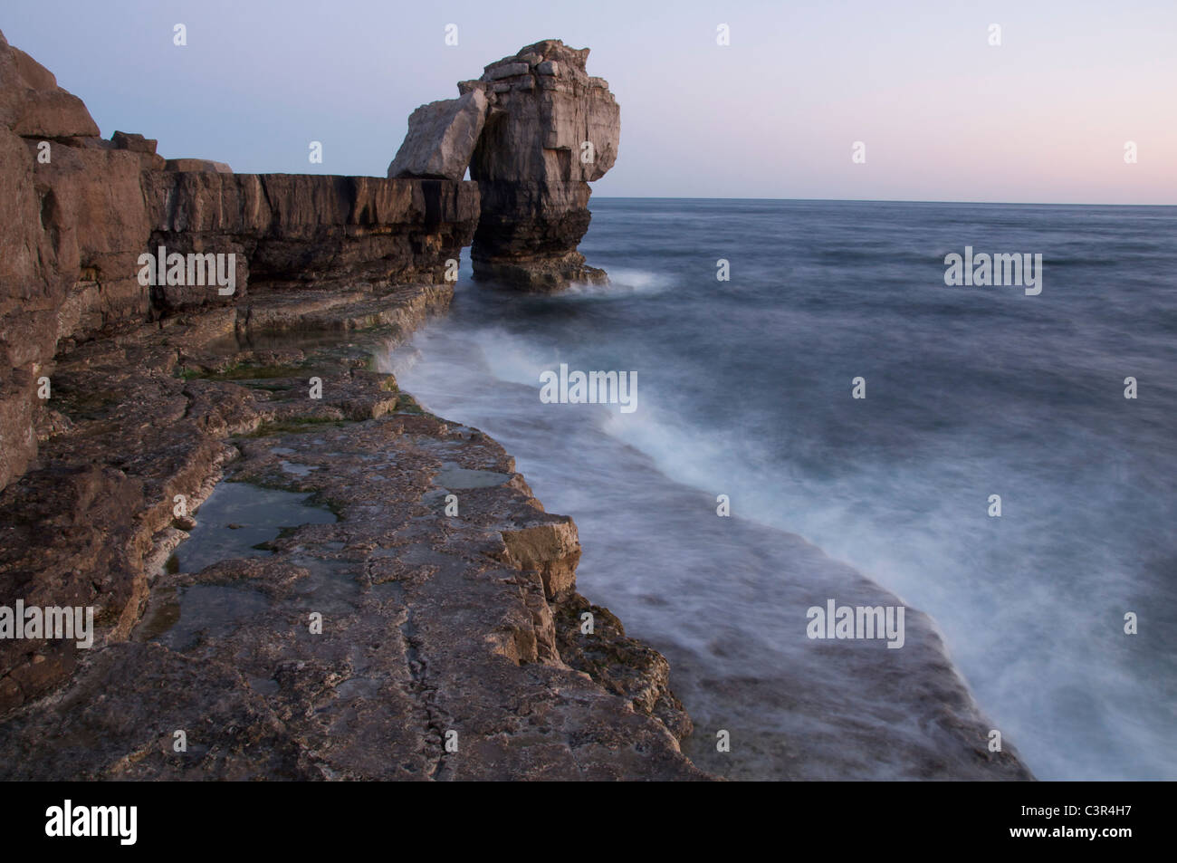 Pulpit Rock in a stormy sea. This massive limestone stack stands just ...