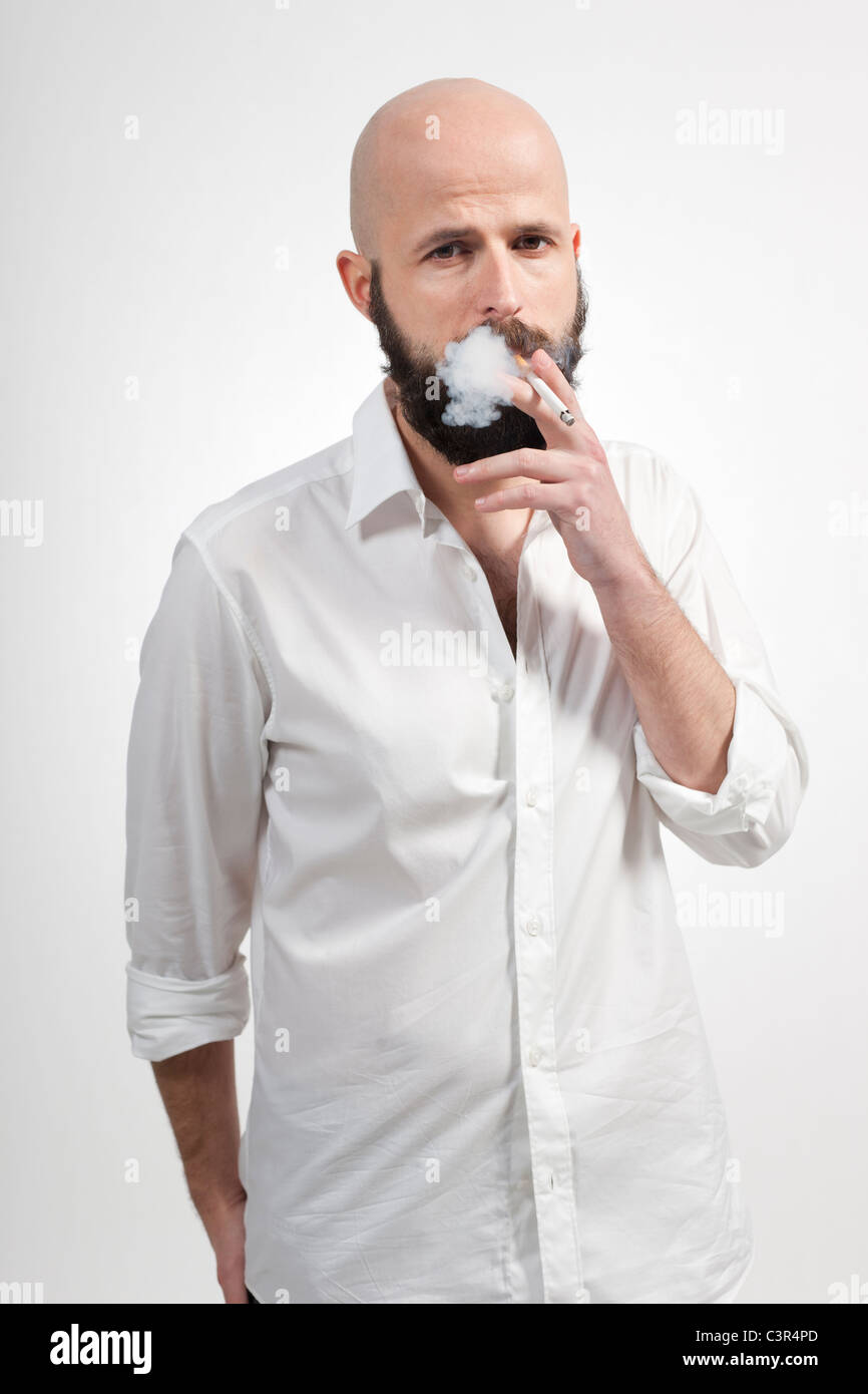 Man smoking cigarette, portrait Stock Photo - Alamy