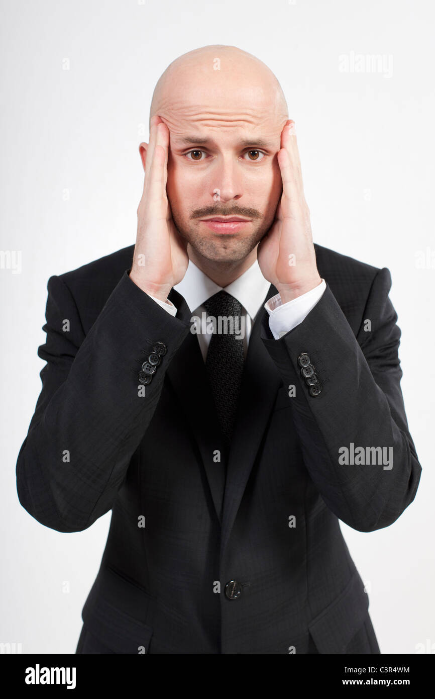 Man with head in hands, portrait Stock Photo - Alamy