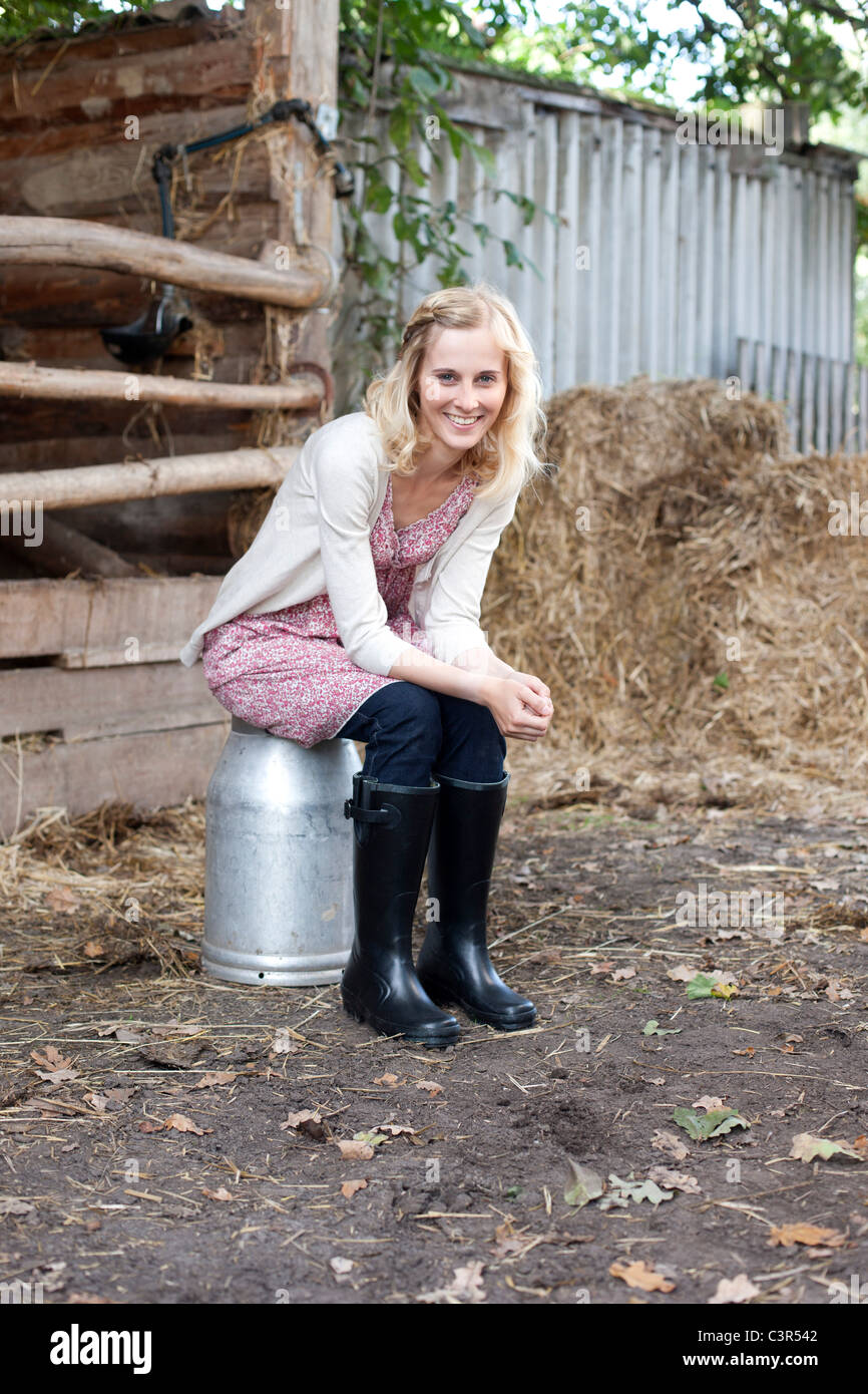 Germany, Saxony, Young woman smiling, portrait Stock Photo - Alamy