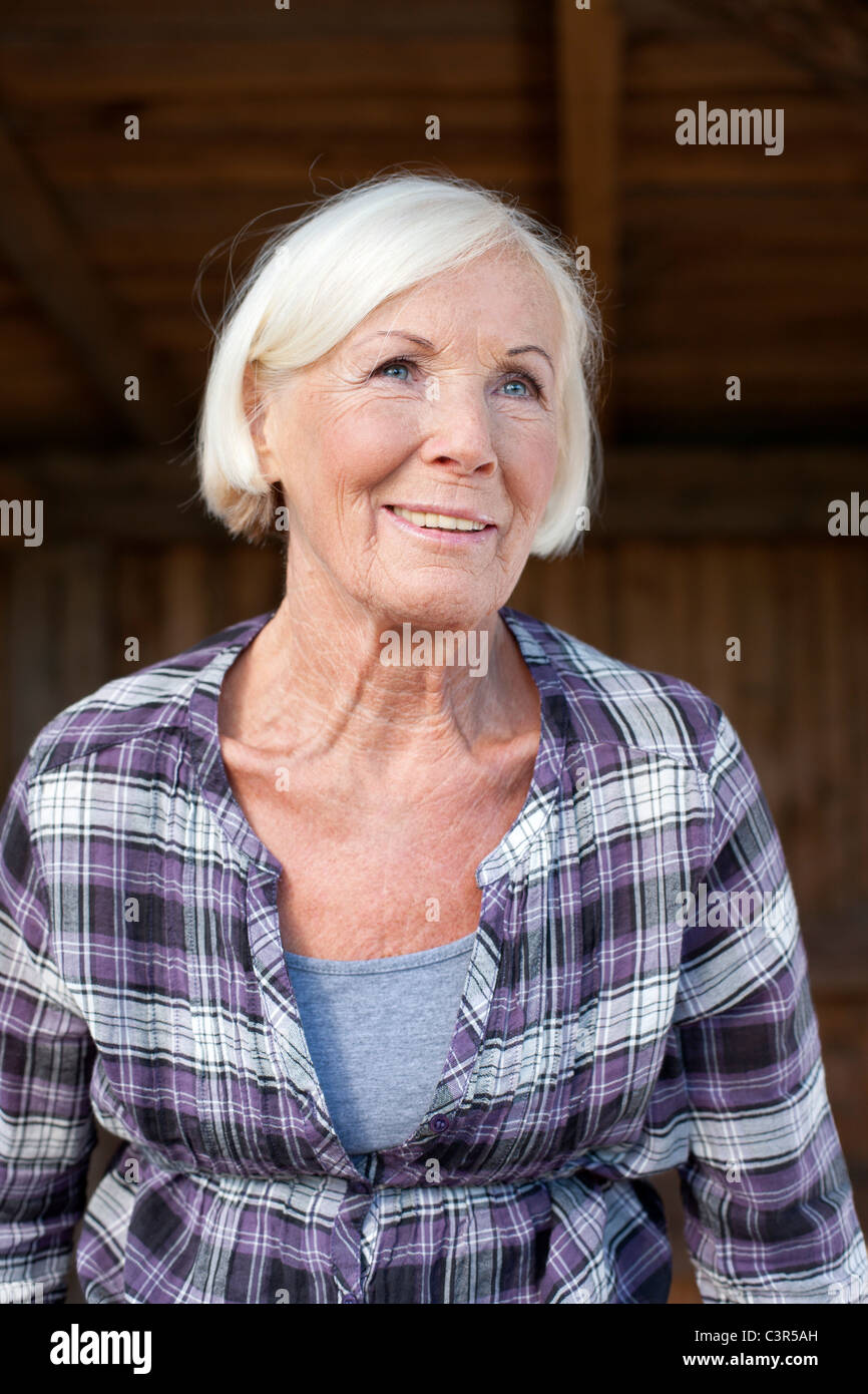 Germany, Saxony, Senior woman at the farm, smiling Stock Photo - Alamy