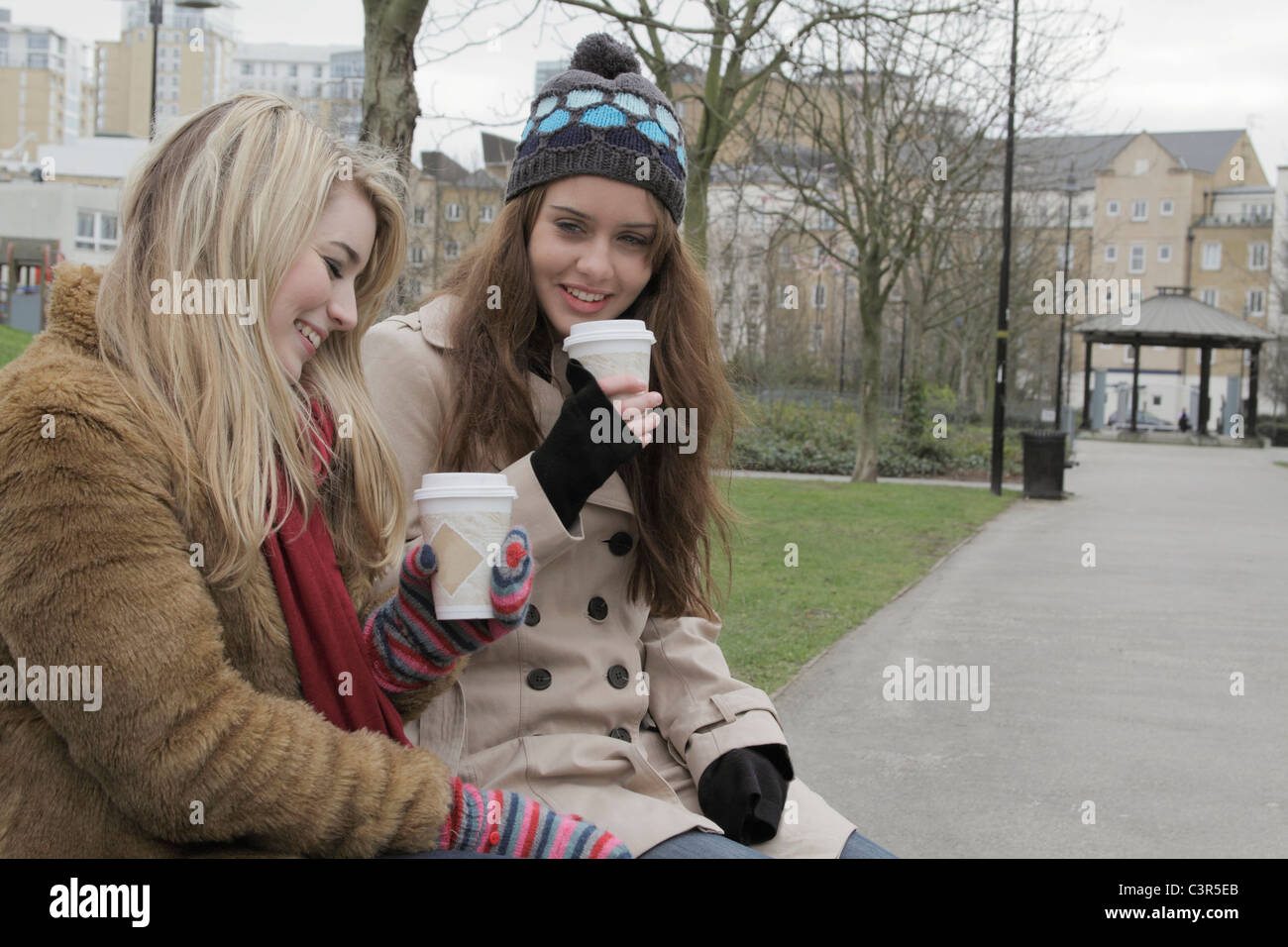 2 young women with take up cups Stock Photo - Alamy