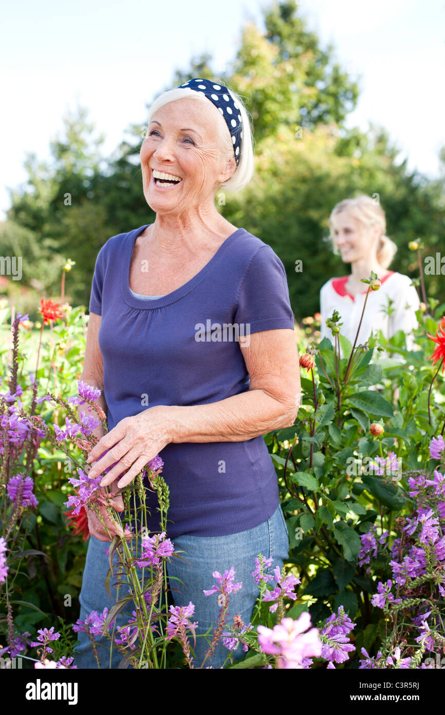 Germany, Saxony, Women smiling with young women in background Stock ...