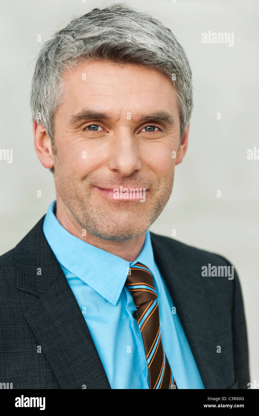 Germany, Hamburg, Businessman smiling, portrait Stock Photo - Alamy