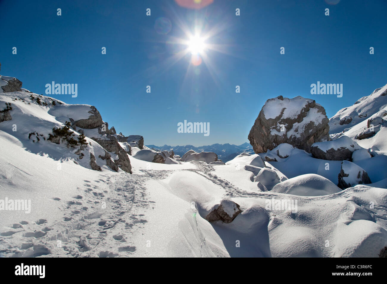 Walking track through winter landscape Stock Photo - Alamy