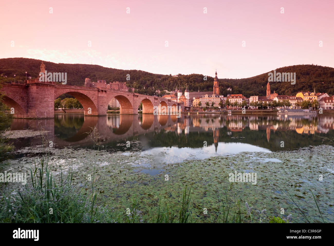 Germany, Heidelberg, View of Old bridge over neckar river with castle ...