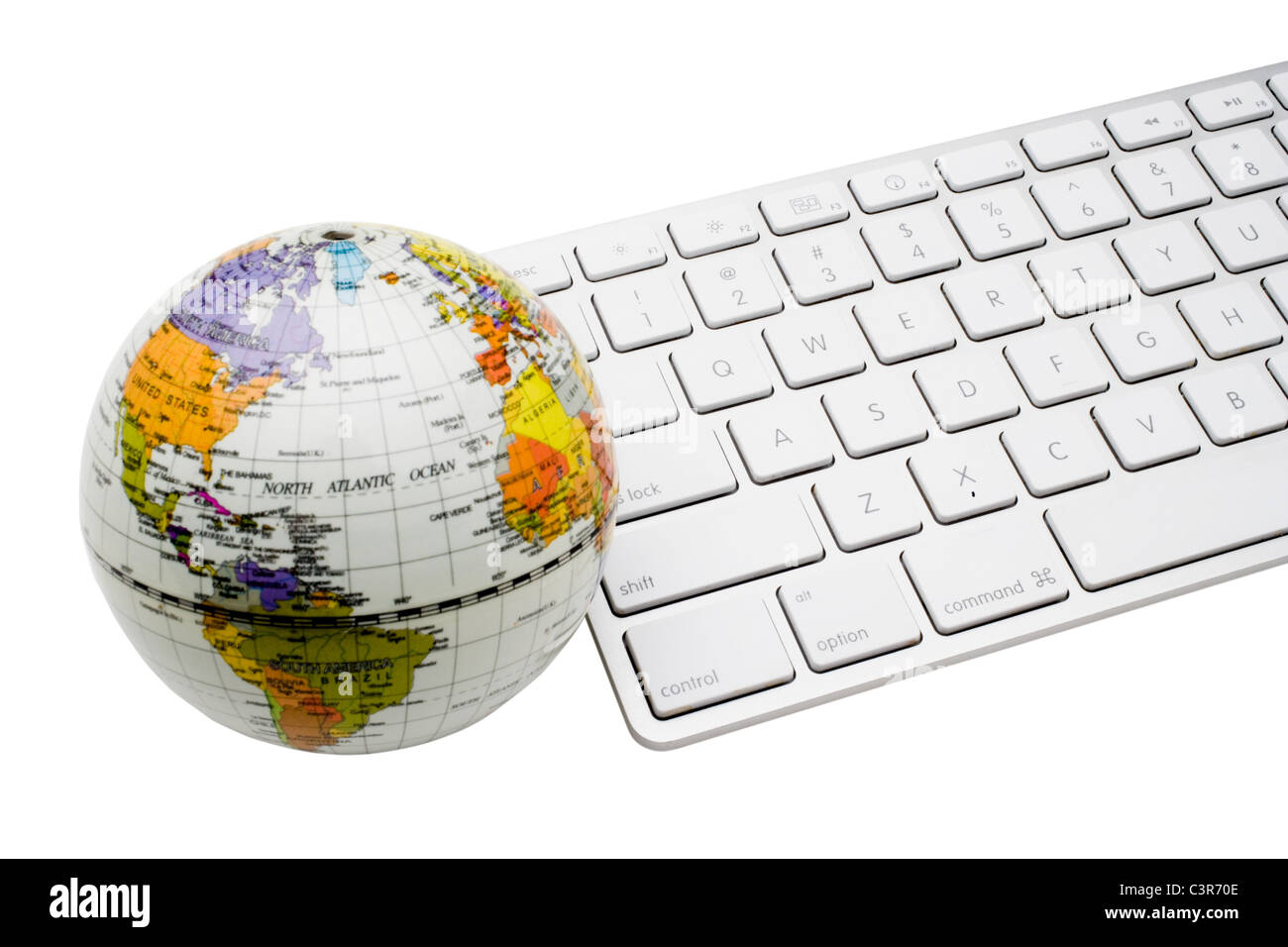 Computer keyboard with a globe isolated over white Stock Photo - Alamy