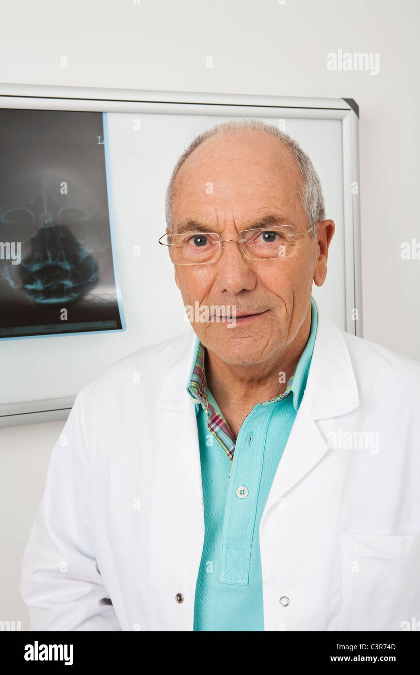 Germany, Munich, Doctor wearing spectacles, smiling, portrait Stock ...