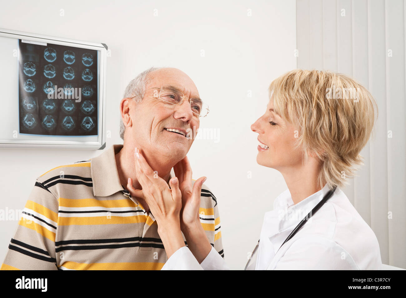 Germany, Munich, Doctor examining patient Stock Photo - Alamy