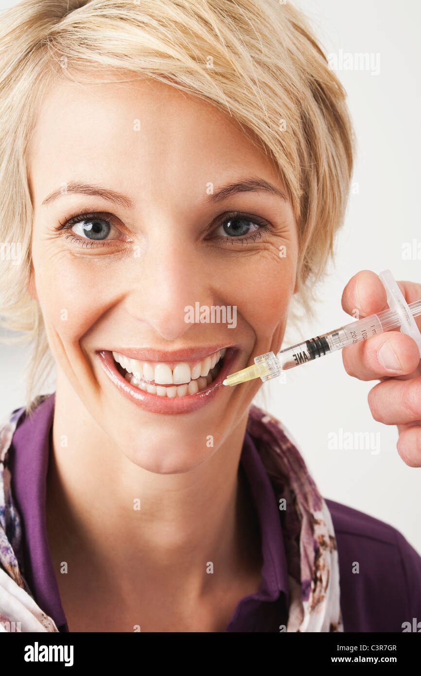 Germany, Munich, Doctor giving Botox treatment to woman Stock Photo - Alamy