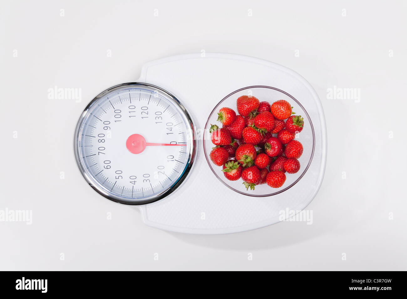 Scale with strawberries Stock Photo - Alamy