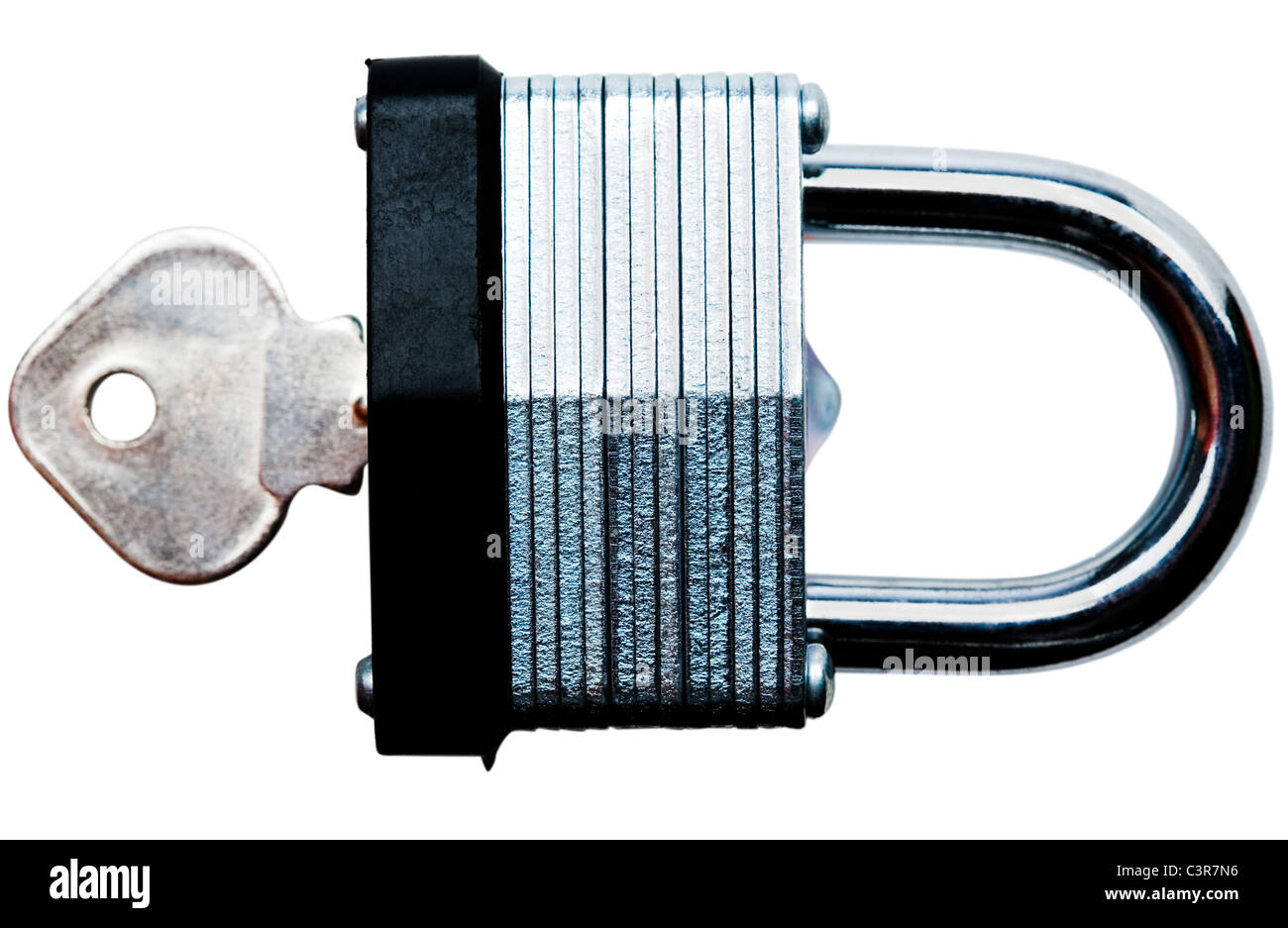 Key in lock isolated over white Stock Photo - Alamy