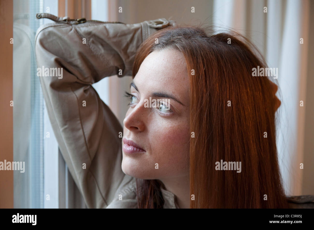 Woman by the window Stock Photo - Alamy