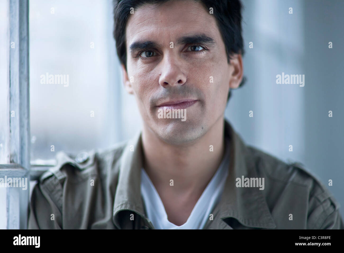 portrait of a man by a window Stock Photo - Alamy