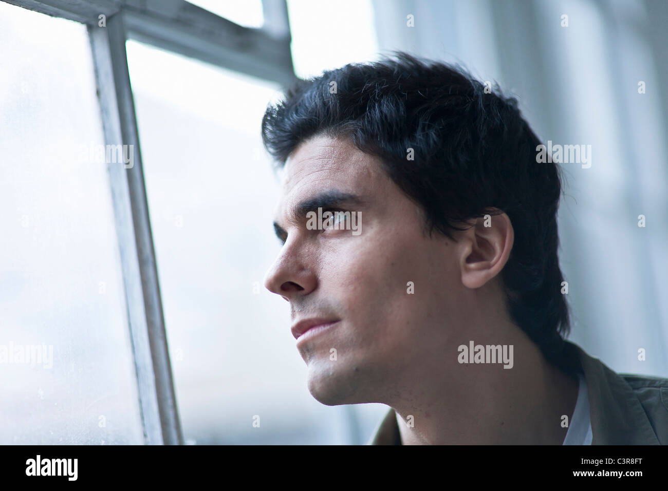 man Looking through the window Stock Photo - Alamy