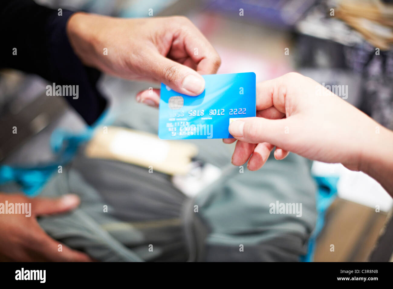 Paying with a card Stock Photo - Alamy
